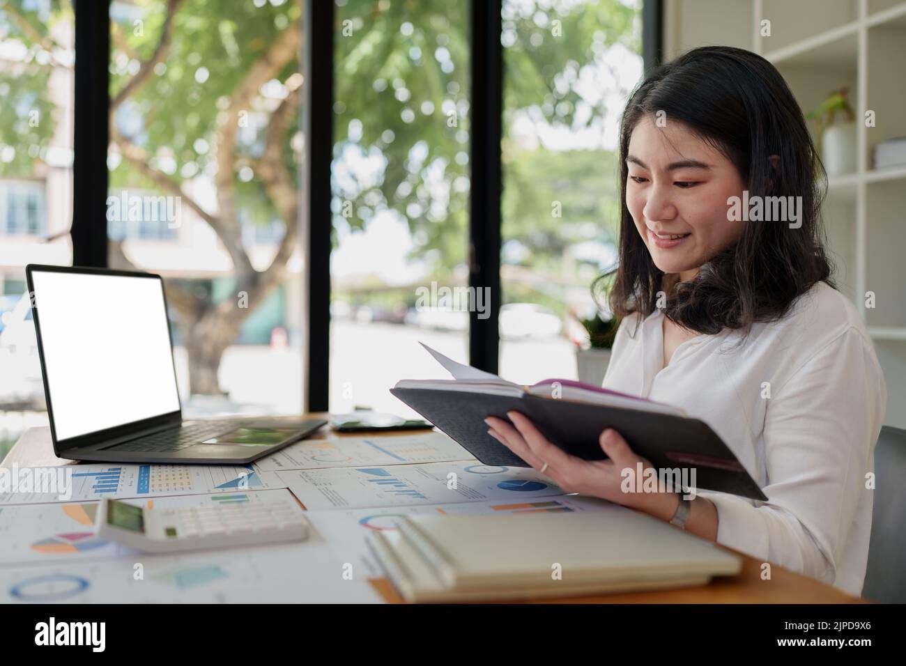 Modern business woman analysis financial with laptop application Stock ...