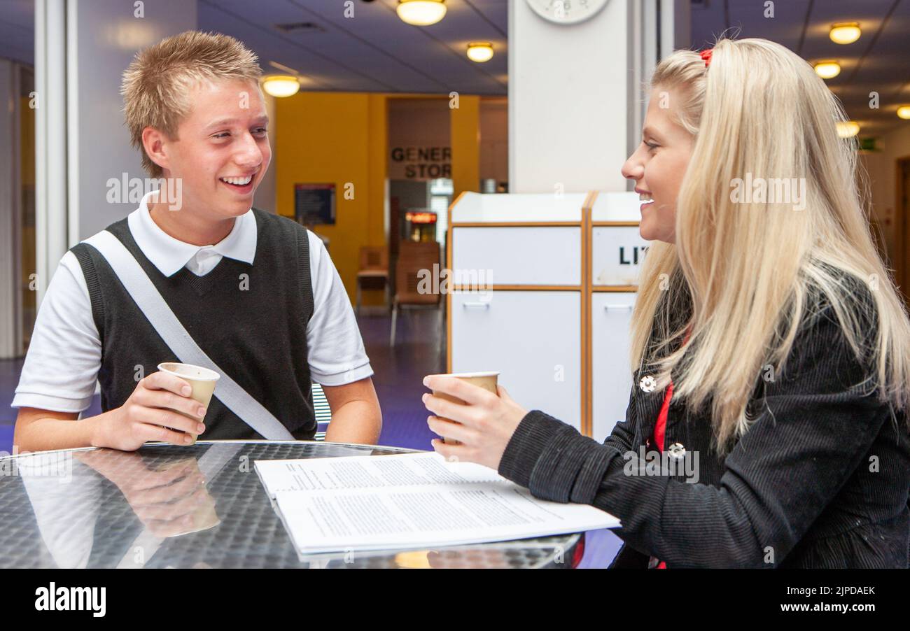 Teenage Students, coffee break. School friends chatting over coffee in ...