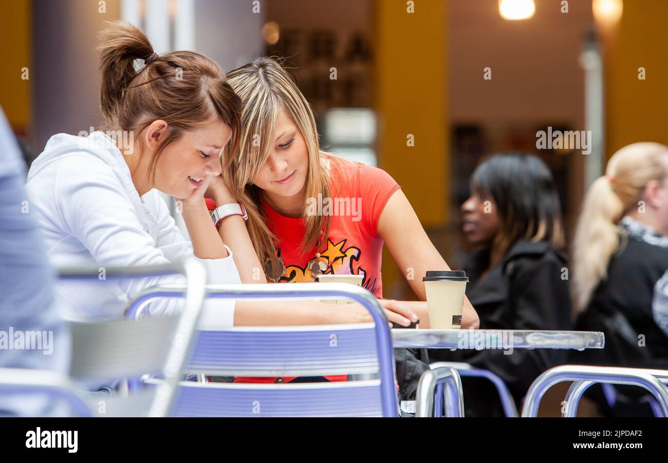 Teenage Students, candid conversation. School friends relaxing over ...