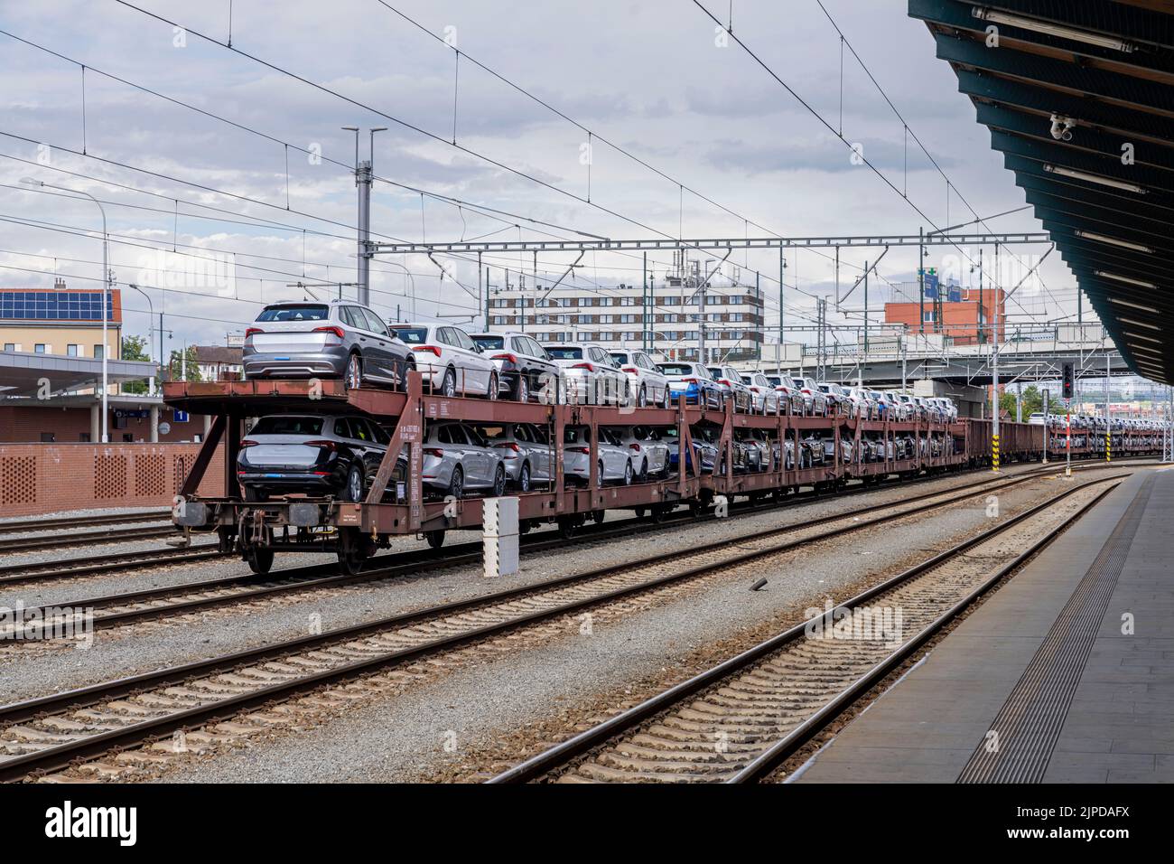 The process of transportation of cars by rail on special wagons. Pilsen ...