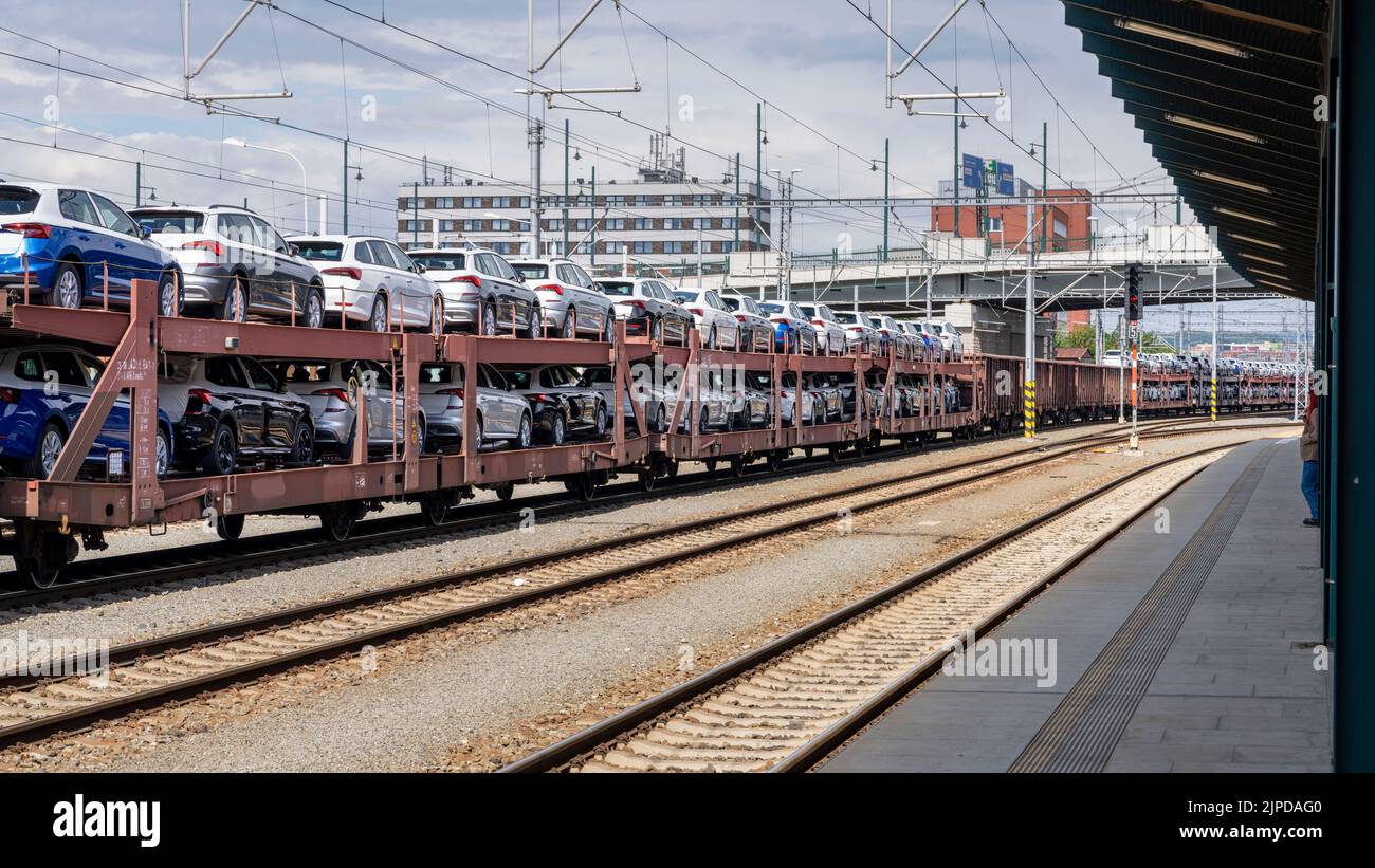 The process of transportation of cars by rail on special wagons. Pilsen ...