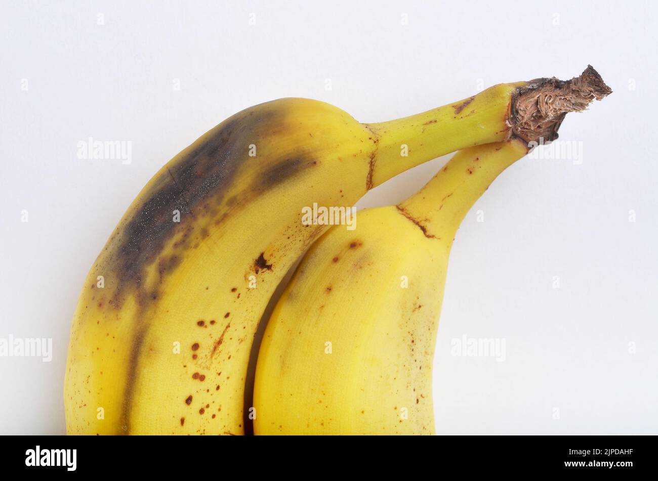 Bruised over ripe banana on white background from directly above Stock ...