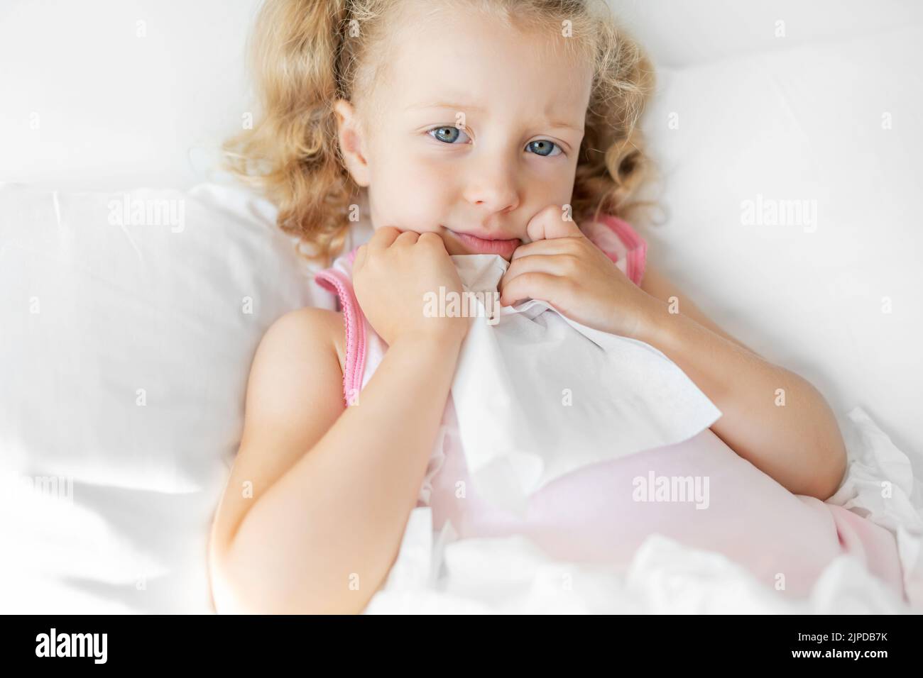 The child lies in bed during an illness Stock Photo - Alamy