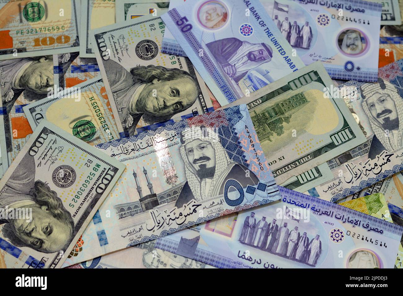 Pile of American dollar bills American cash money banknotes with Saudi ...