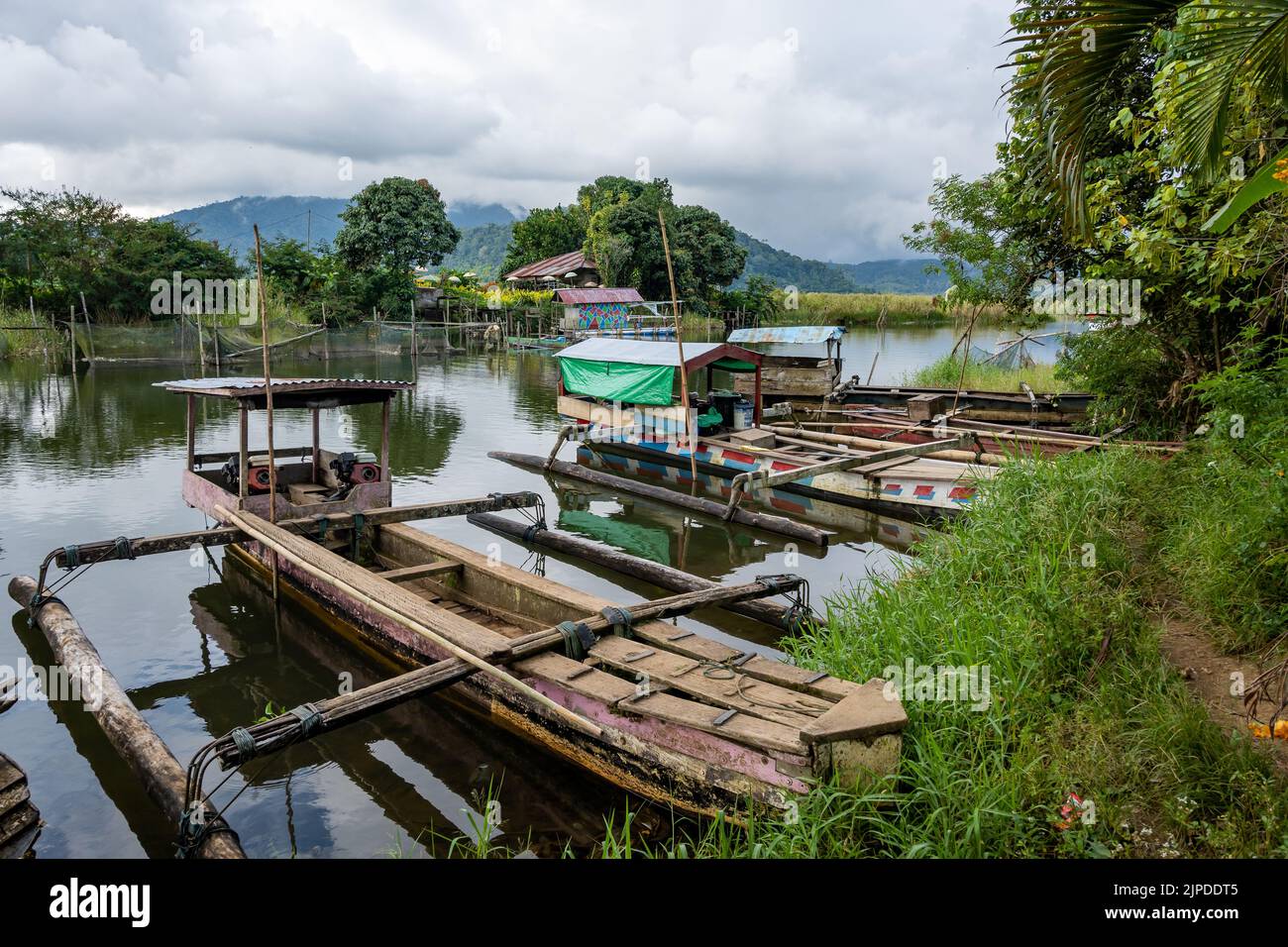 Wooden outrigger boats in a lake. Sulawesi, Indonesia Stock Photo - Alamy