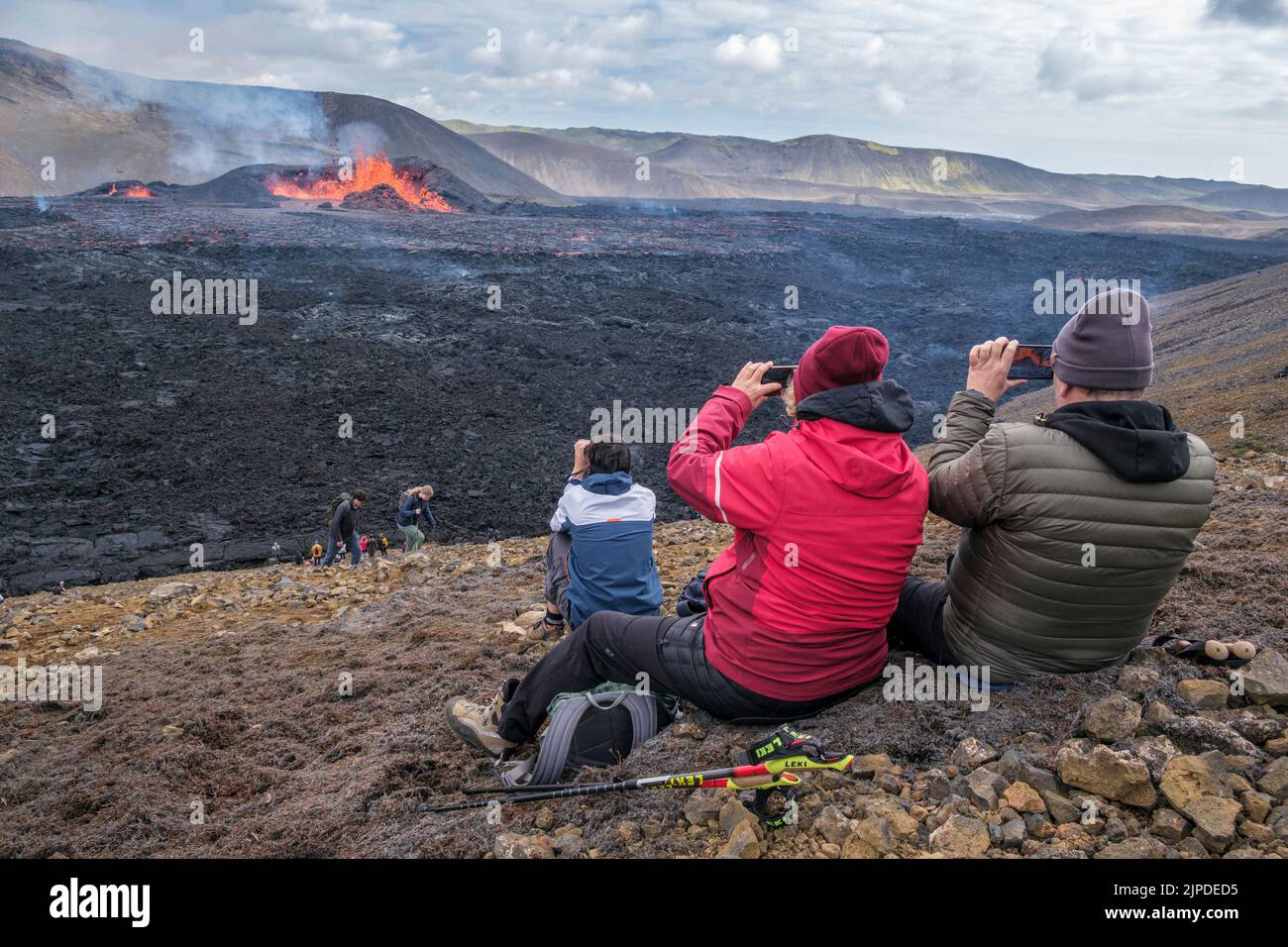 Tourists photographing the eruption of the Meradalir Volcano, Reykjanes ...