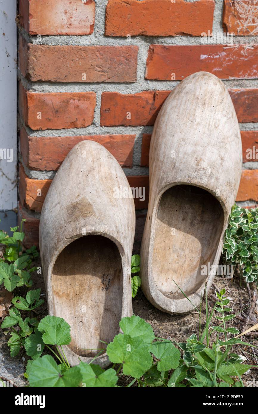 Dutch natural colored clogs at a back door of a Dutch house Stock Photo ...