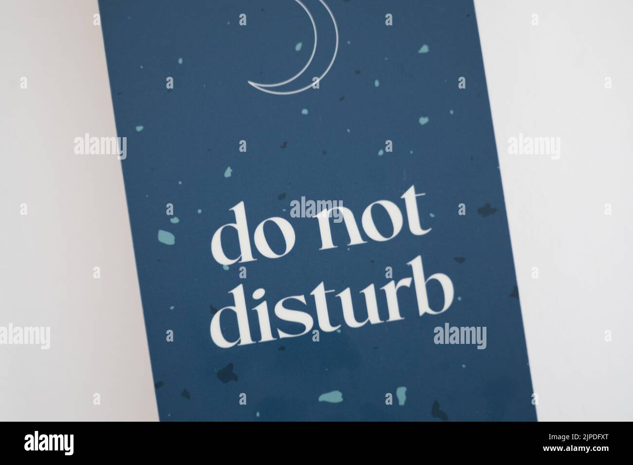 A blue "do not disturb sign" on a white background Stock Photo - Alamy