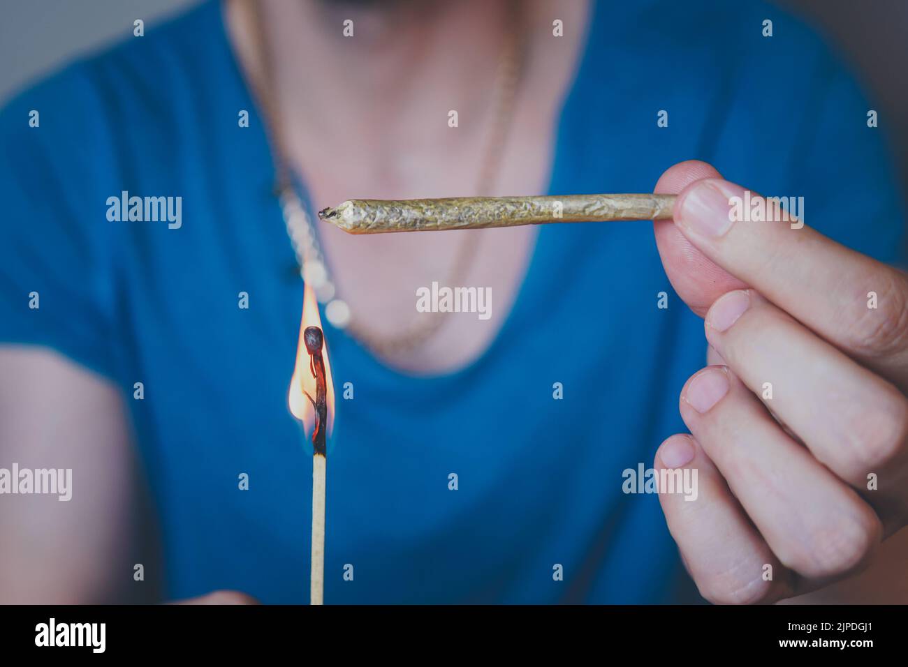 Smoker lights up cigarette hi-res stock photography and images - Alamy