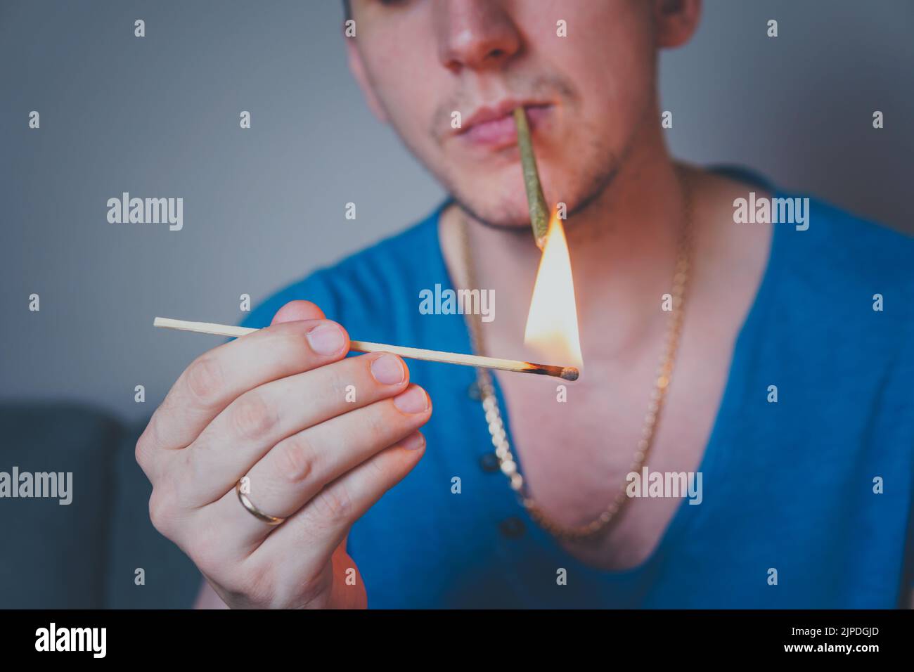 Smoker lights up cigarette hi-res stock photography and images - Alamy