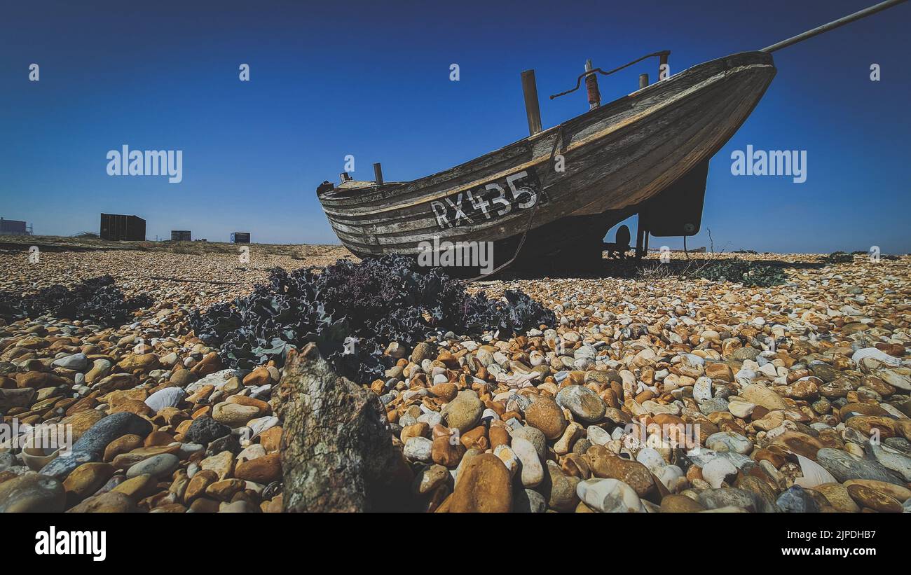 The Dungeness old fishing boats beach in Kent, England on a nice spring ...