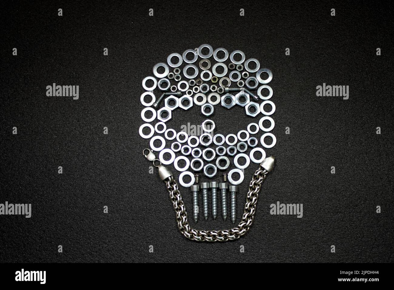 Metal art. Skull made by screw nuts, washers and bolts Stock Photo - Alamy