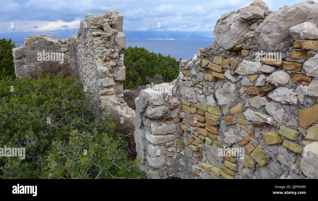 A mesmerizing shot of a stone wall in a landscape under the cloudy sky ...
