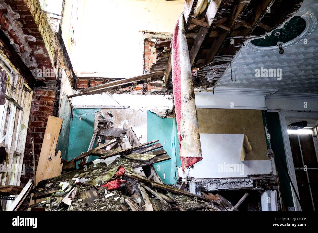 An Irish heritage ruin with a collapsed roof and a hanging carpet Stock ...