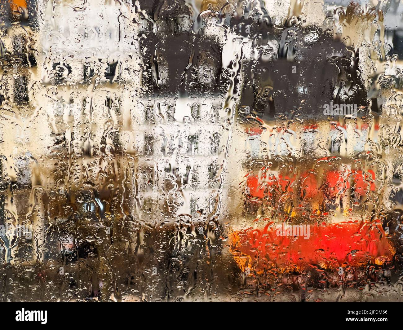 View through the wet window on roofs of Paris buildings Stock Photo - Alamy