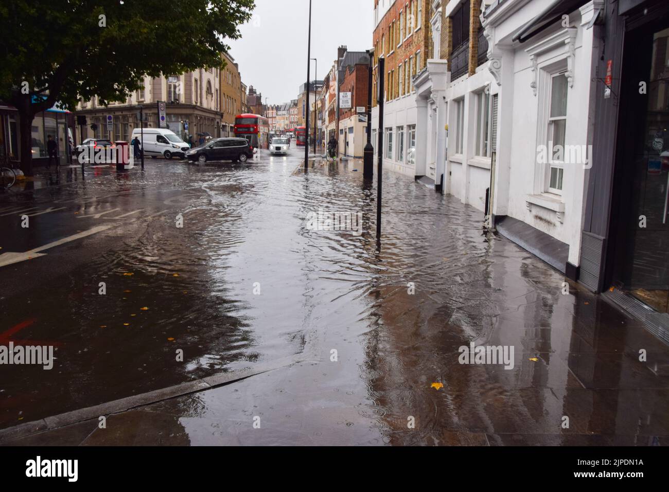 London, UK. 17th August 2022. A flooded King's Cross Road as torrential ...