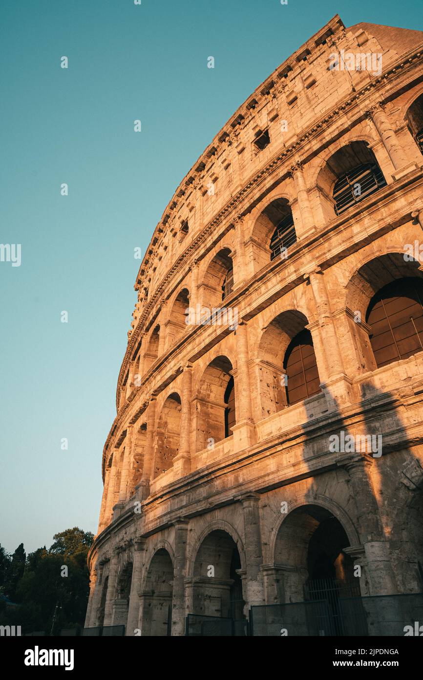 A vertical shot of the Colosseum amphitheater in the center of the city ...