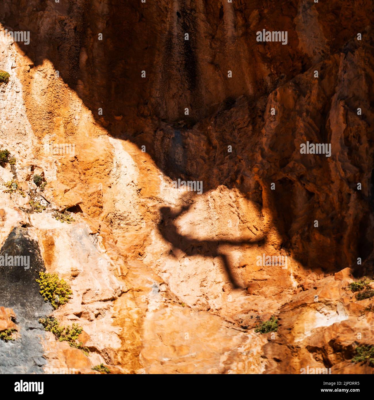 Shadow of a rock climber, climbing on the mountain Stock Photo - Alamy