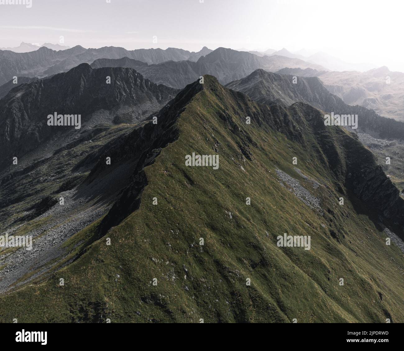An aerial view of a beautiful chain of high rocky mountains Stock Photo ...