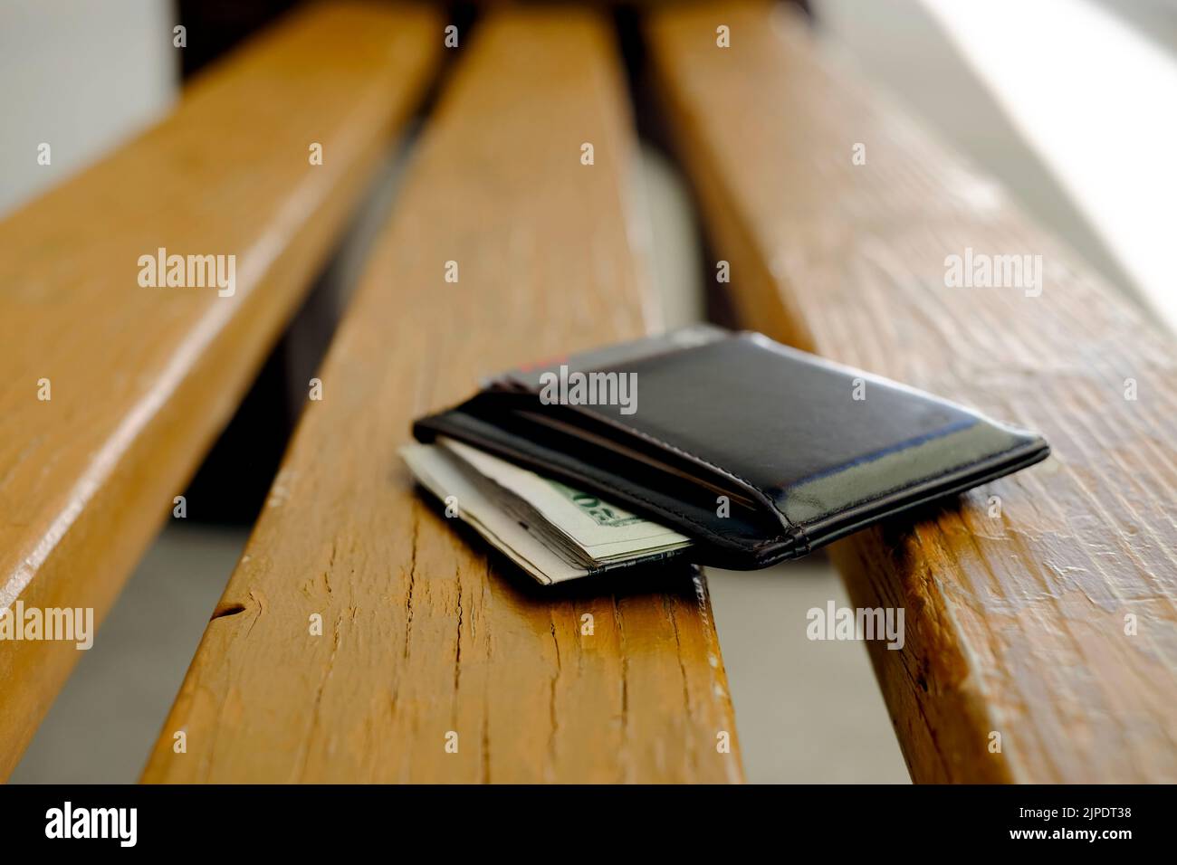 Lost wallet with cash on a bench seat forgotten and abandoned Stock ...