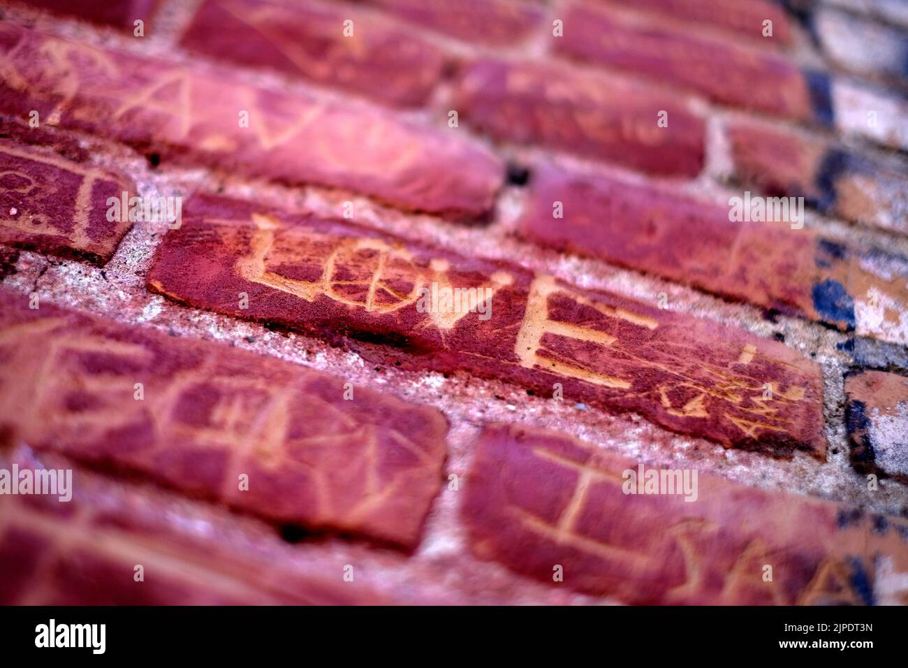 Written writing on bricks hi-res stock photography and images - Alamy