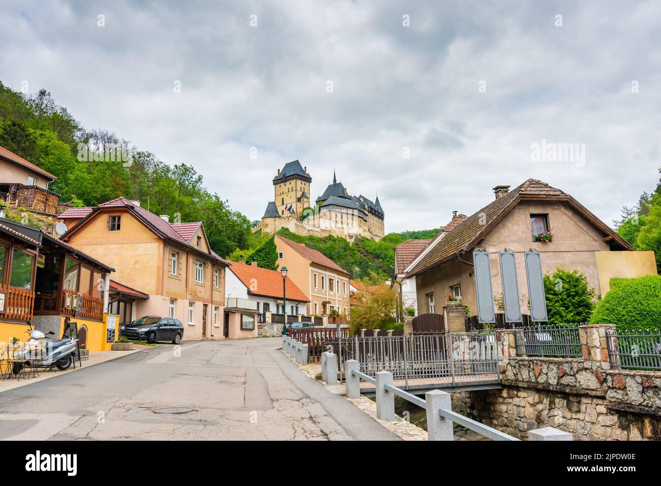 Main street leading to the famous gothic castle Karlstejn. Streed shops ...