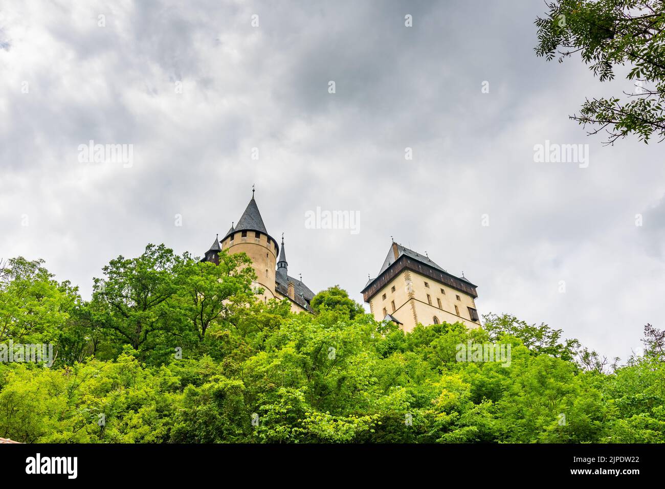 Famous medieval gothic castle Karlstejn on top of the hill. Beautiful ...