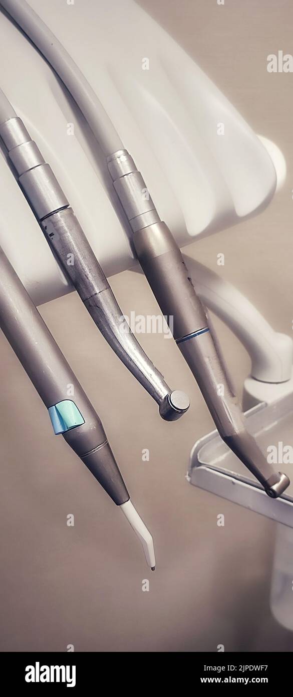 A vertical shot of dental instruments - prosthetics, invisalign ...
