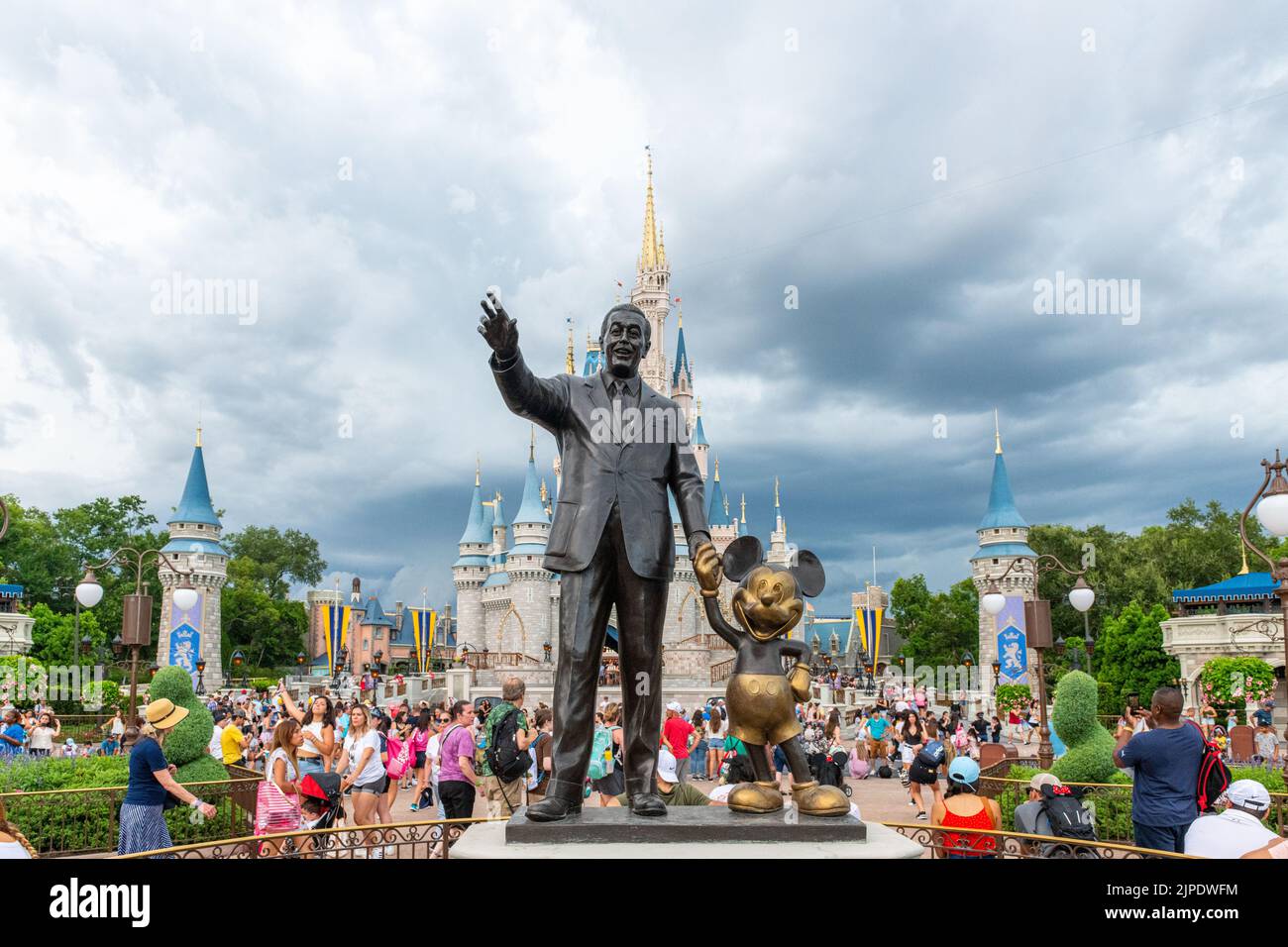 Walt Disney and Mickey Mouse statue inside of the Magic Kingdom theme ...