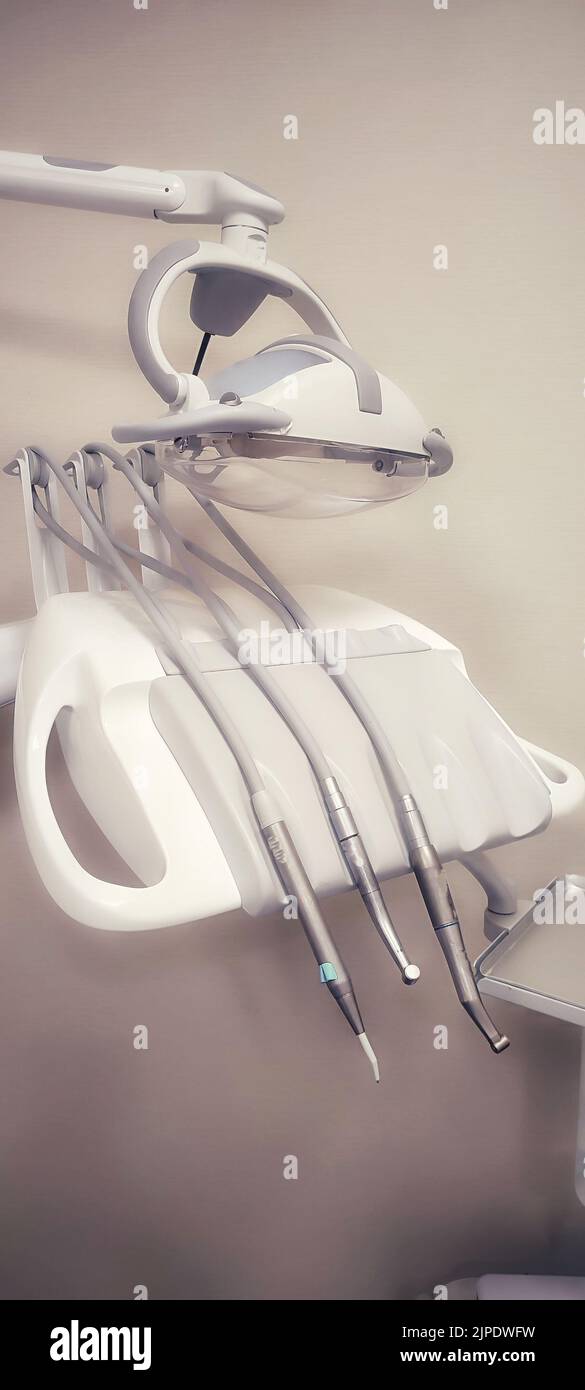 A vertical shot of dental instruments - prosthetics, invisalign ...