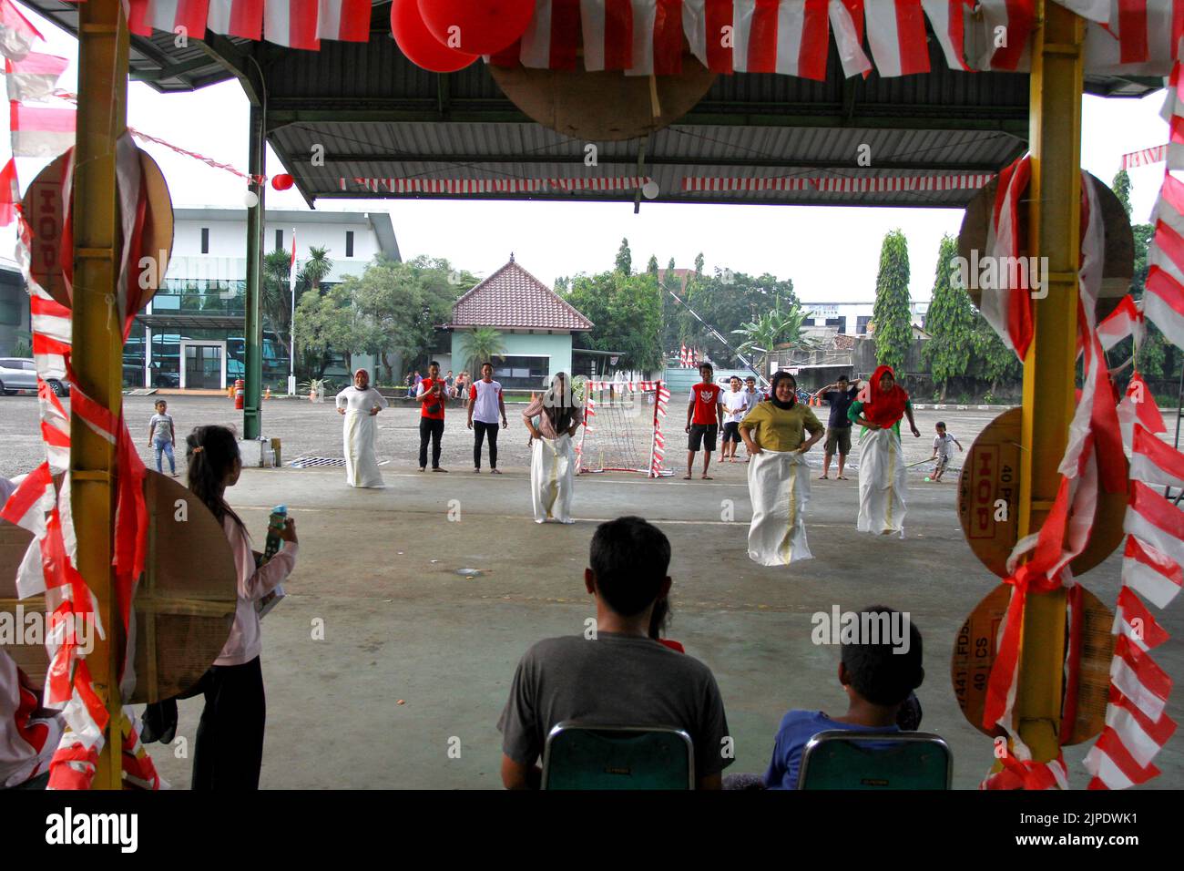 Pandeglang, Indonesia. 17th Aug, 2022. People take part in a sack race ...