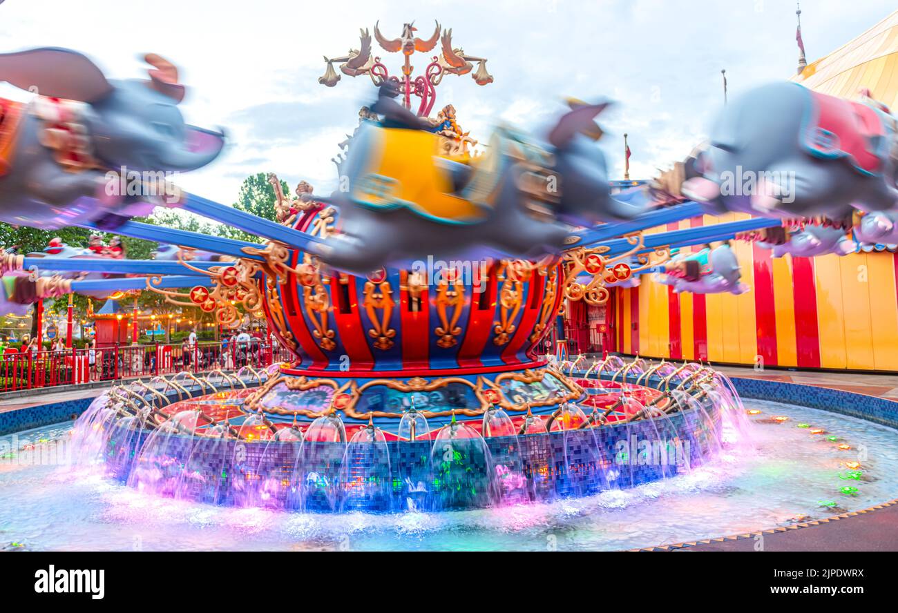 Blurred motion of the amusement park ride named Dumbo the Flying ...