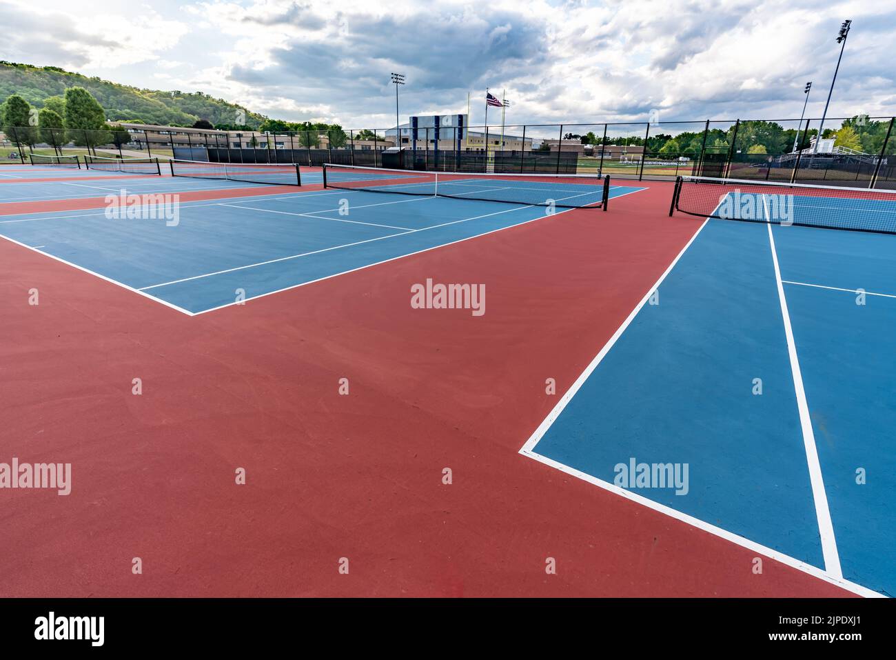 New blue outdoor tennis courts with white lines and red out of play ...