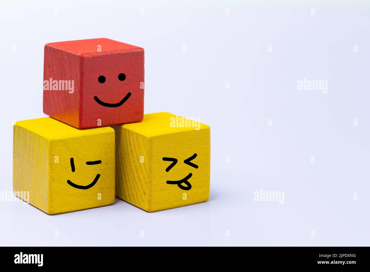 smiling faces, drawn on colored wooden blocks, Concept, positive ...