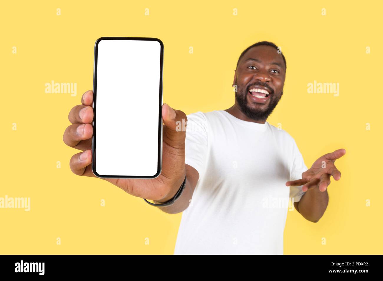 Cheerful Black Man Showing Huge Smartphone Empty Screen, Yellow ...