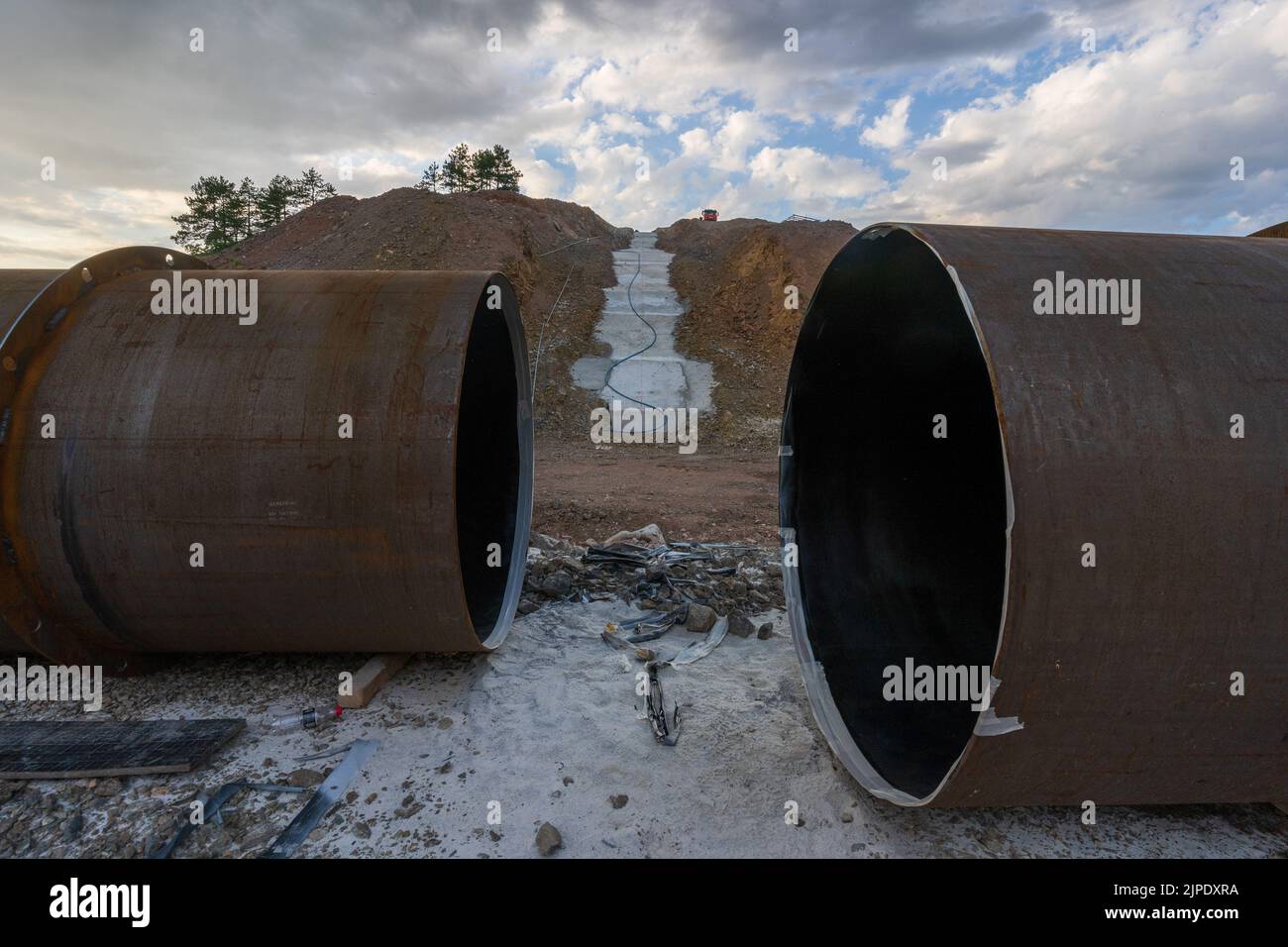 A big brown pipes for water dam construction Stock Photo - Alamy