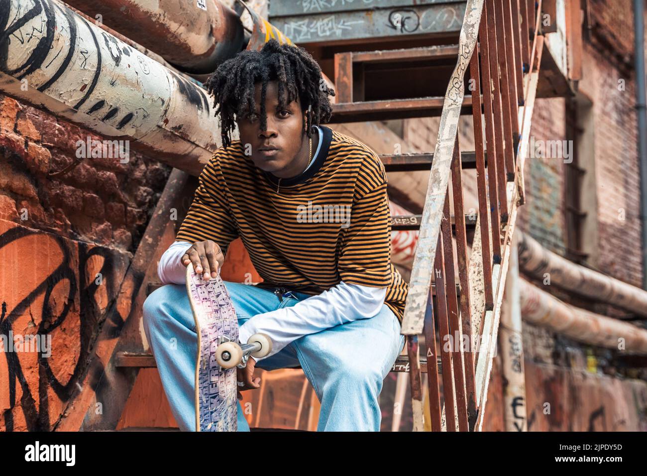 Young handsome stylish black man with natural hair dreadlocks ...