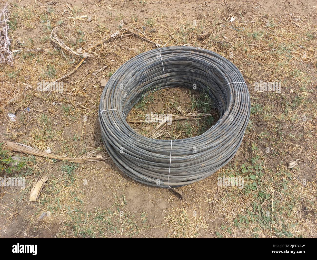 A tire wire for construction on the ground Stock Photo - Alamy