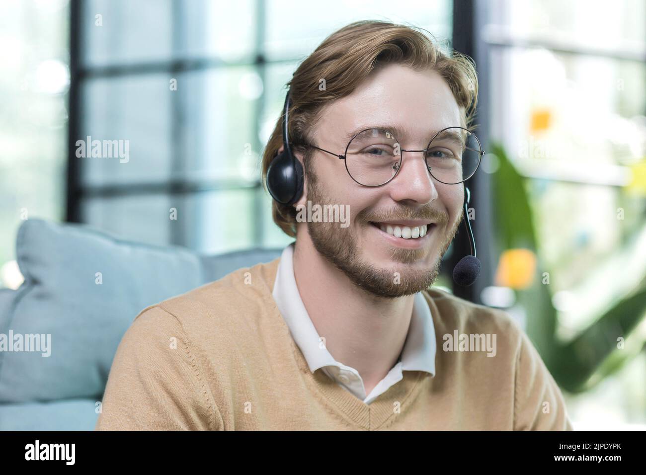 Close-up photo of man wearing headset for video call, businessman ...