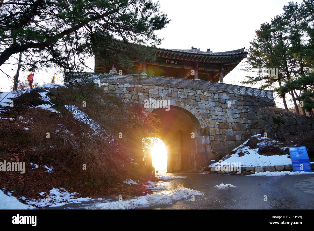 sunset seen through the gates Stock Photo - Alamy