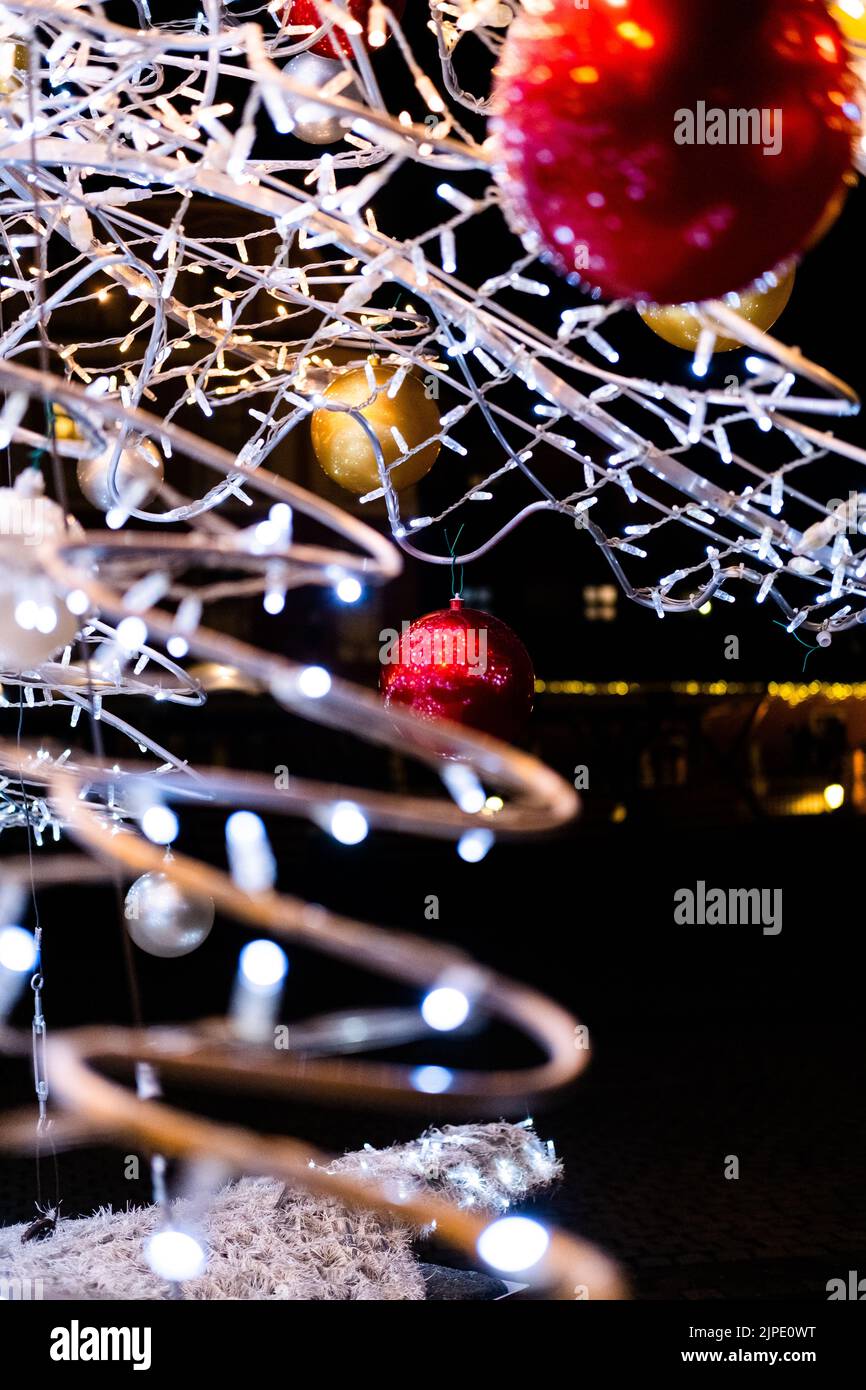 A part of creative decorated Christmas tree made of metallic twigs ...