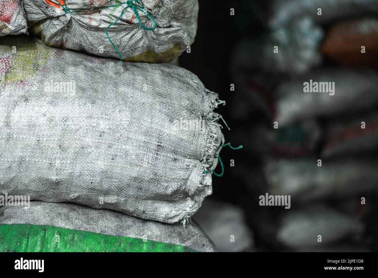 detailed view of white sacks filled with material and products inside a ...