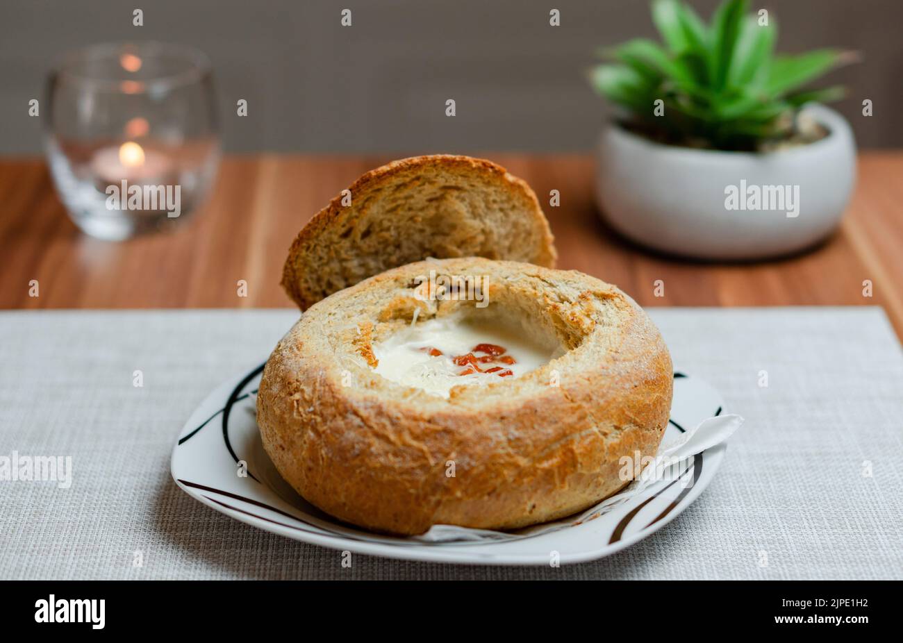 Garlic Cream Soup Served In a Loaf Stock Photo - Alamy