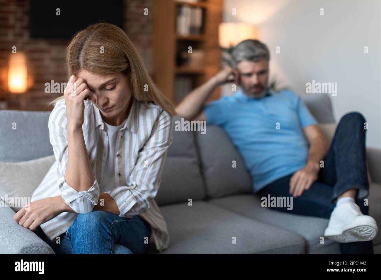 Upset middle aged caucasian male with beard ignores offended lady after ...