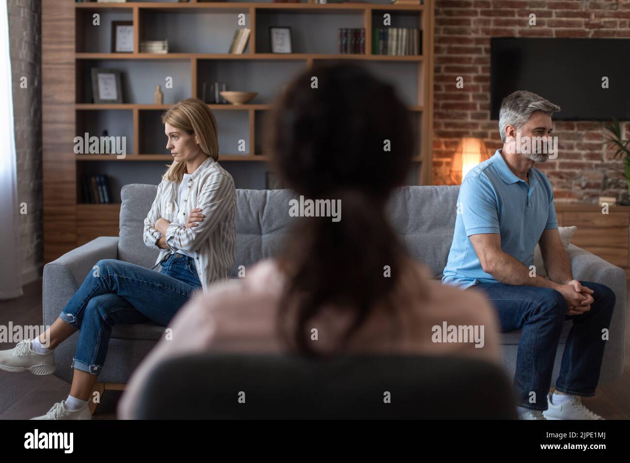 Offended angry adult caucasian man ignores woman at meeting with black ...