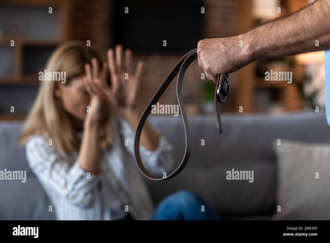 Scared middle aged caucasian lady covering face, afraid of aggressive ...
