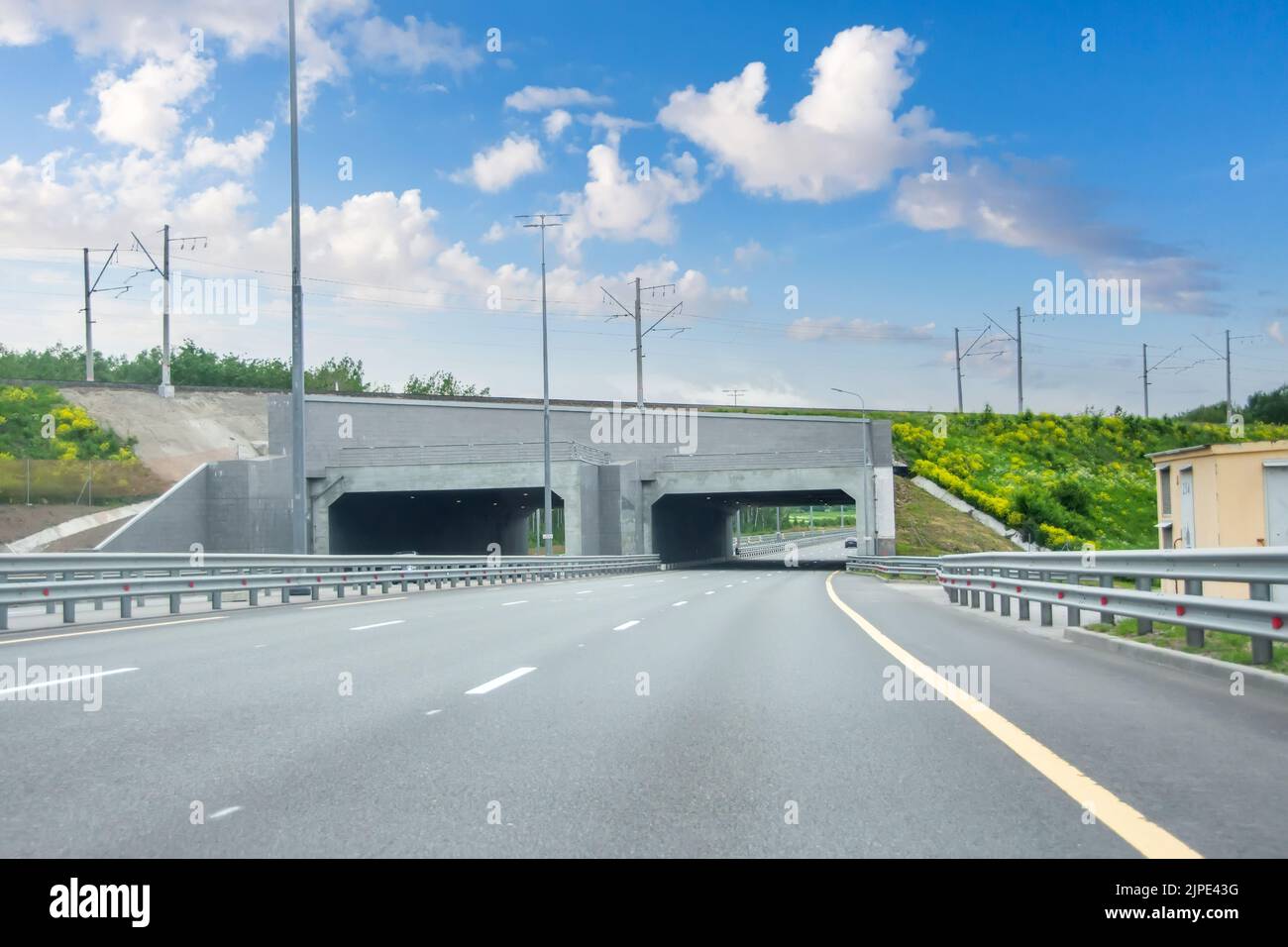 View from the car at the turn under the interchange and the tunnel ...