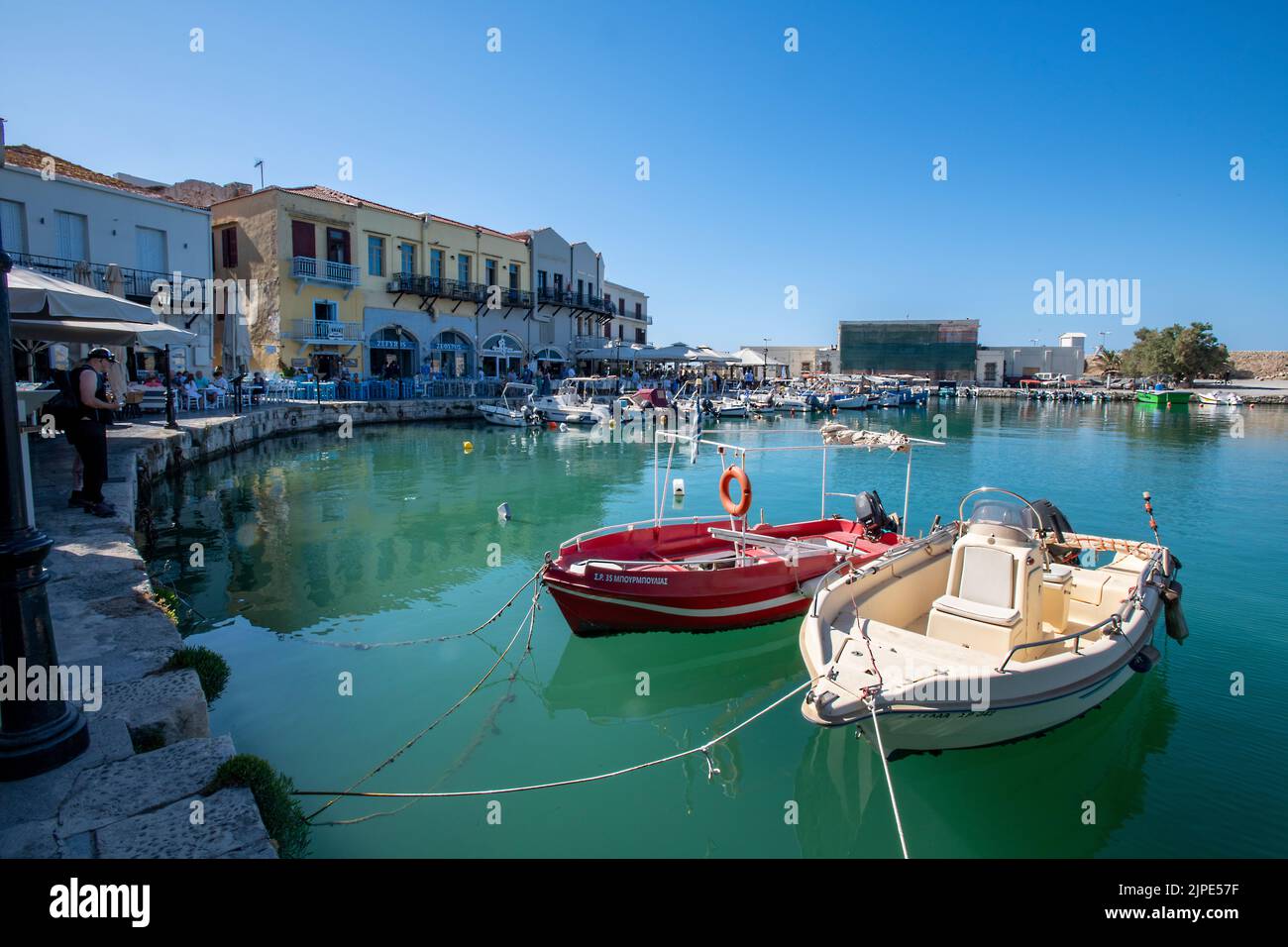 boats tied up in the harbour at rethymno on the greek island of crete ...