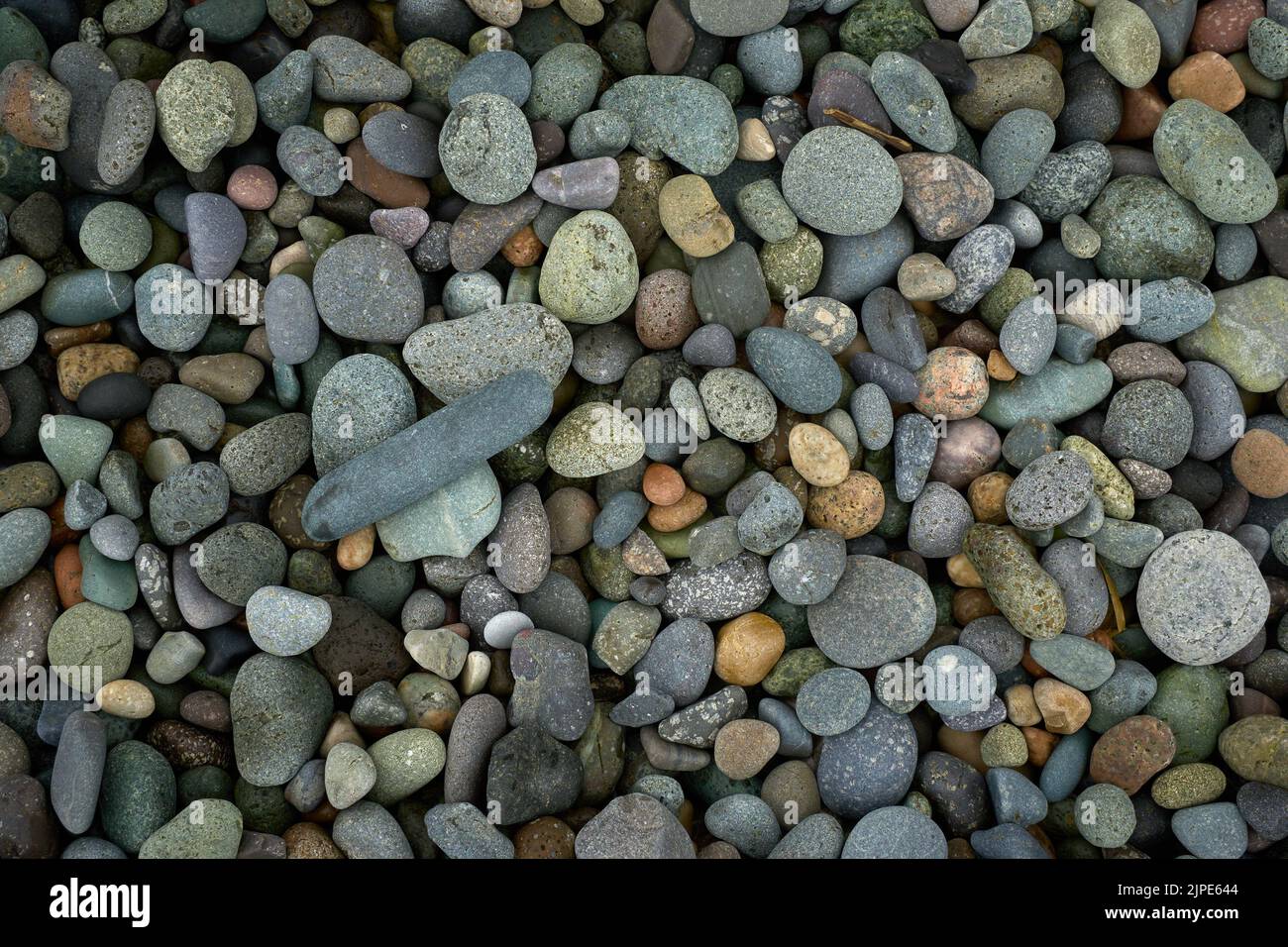 Abstract background texture of random sizes of stones and colored ...