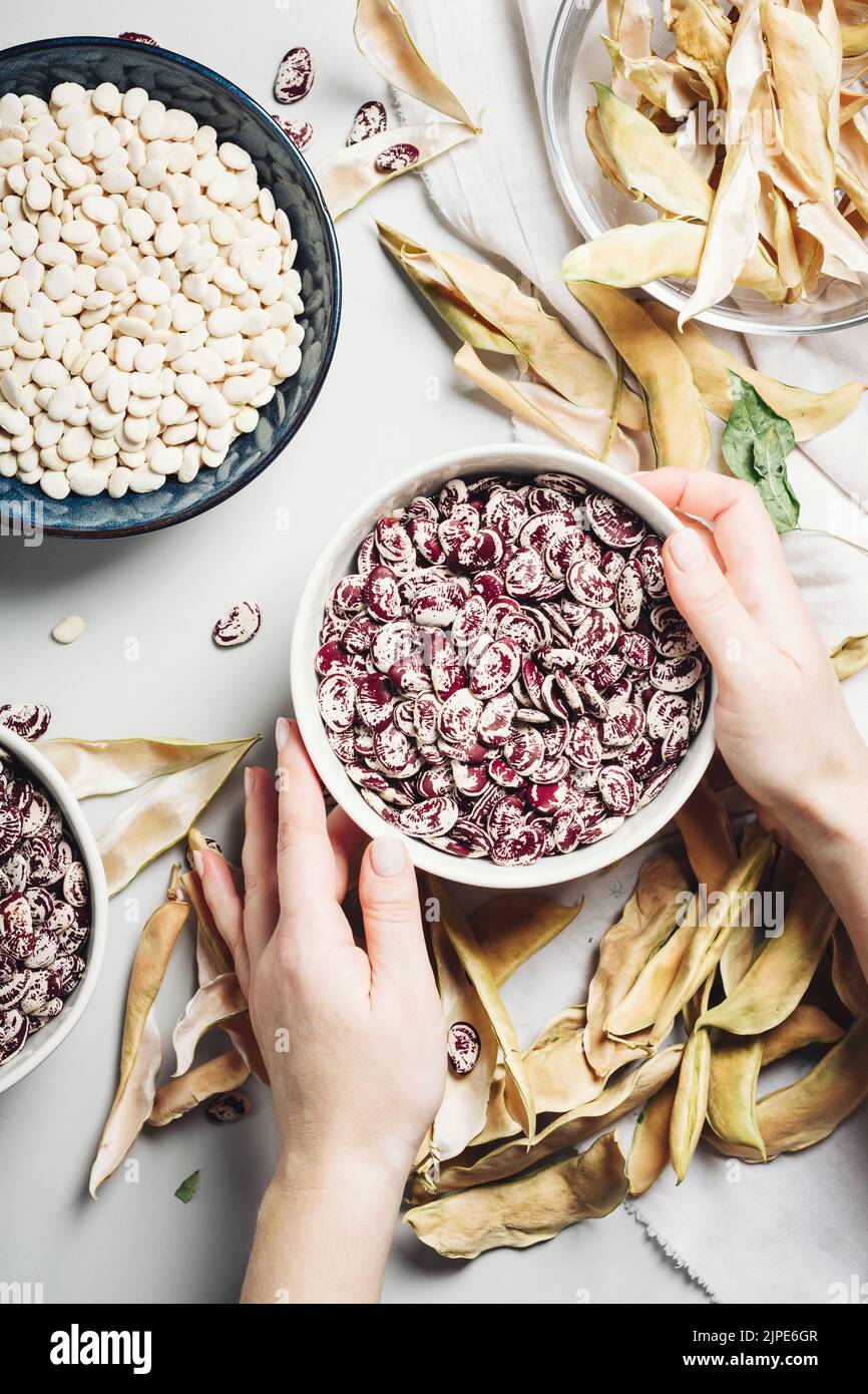 Freshly harvested dry white and red beans in bowls, top view Stock ...